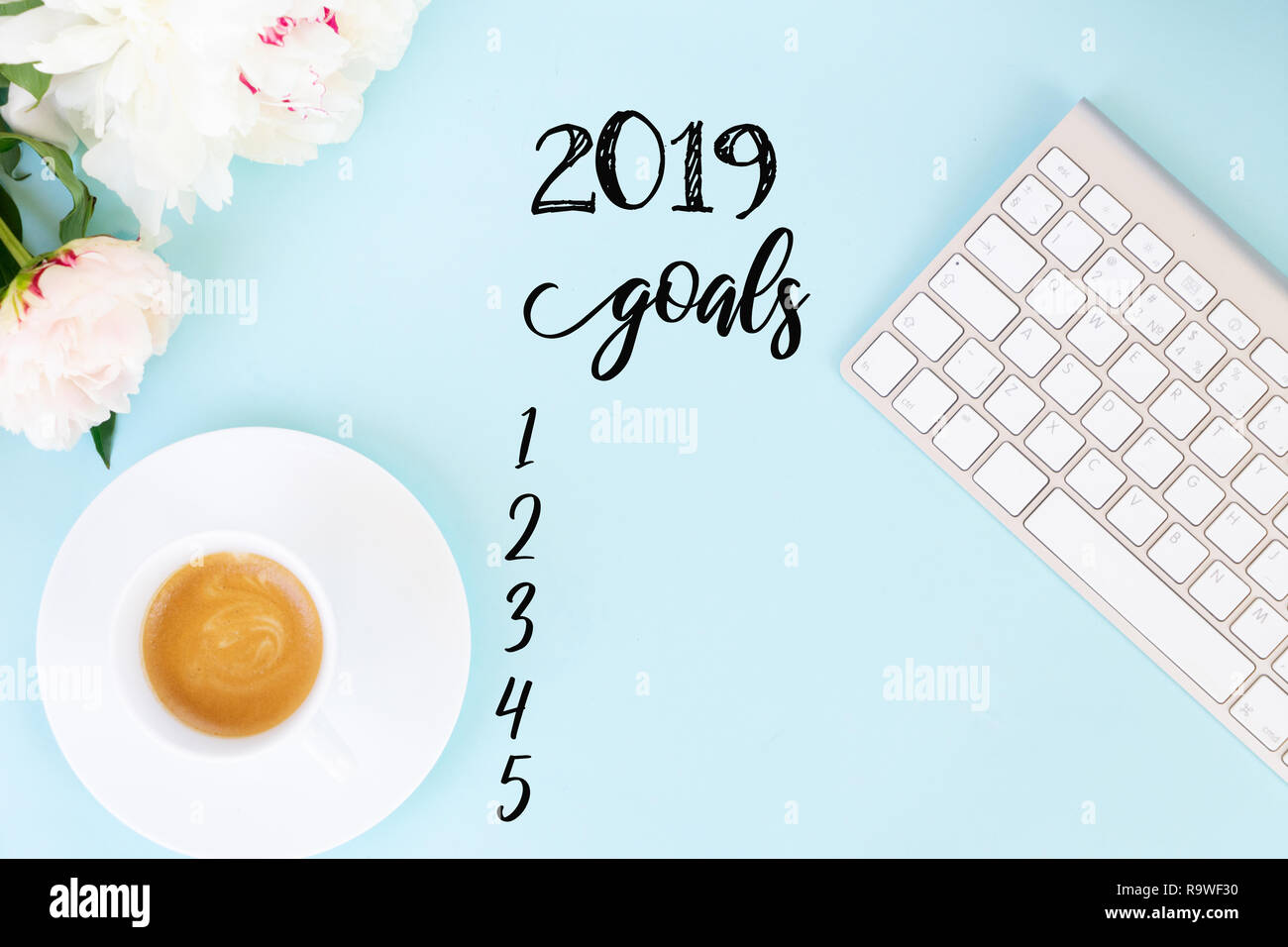 Top view 2019 goals list with office workspace frame with white modern ...