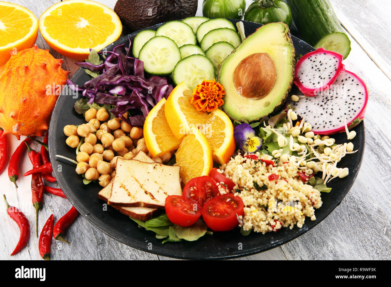 grilled tofu and dragon fruit buddha bowl with vegetable and humus ...