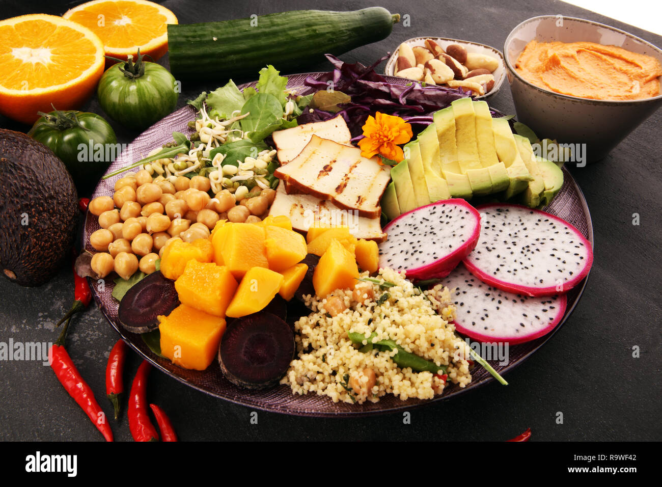 grilled tofu and dragon fruit buddha bowl with vegetable and humus ...
