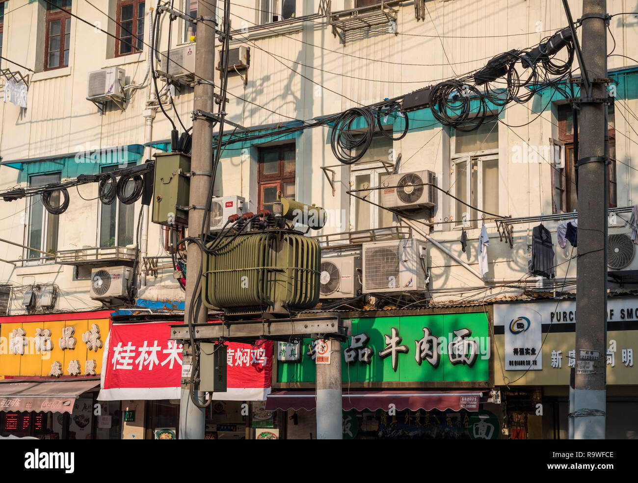 Electric and telephone cabling on building walls in Shanghai China ...