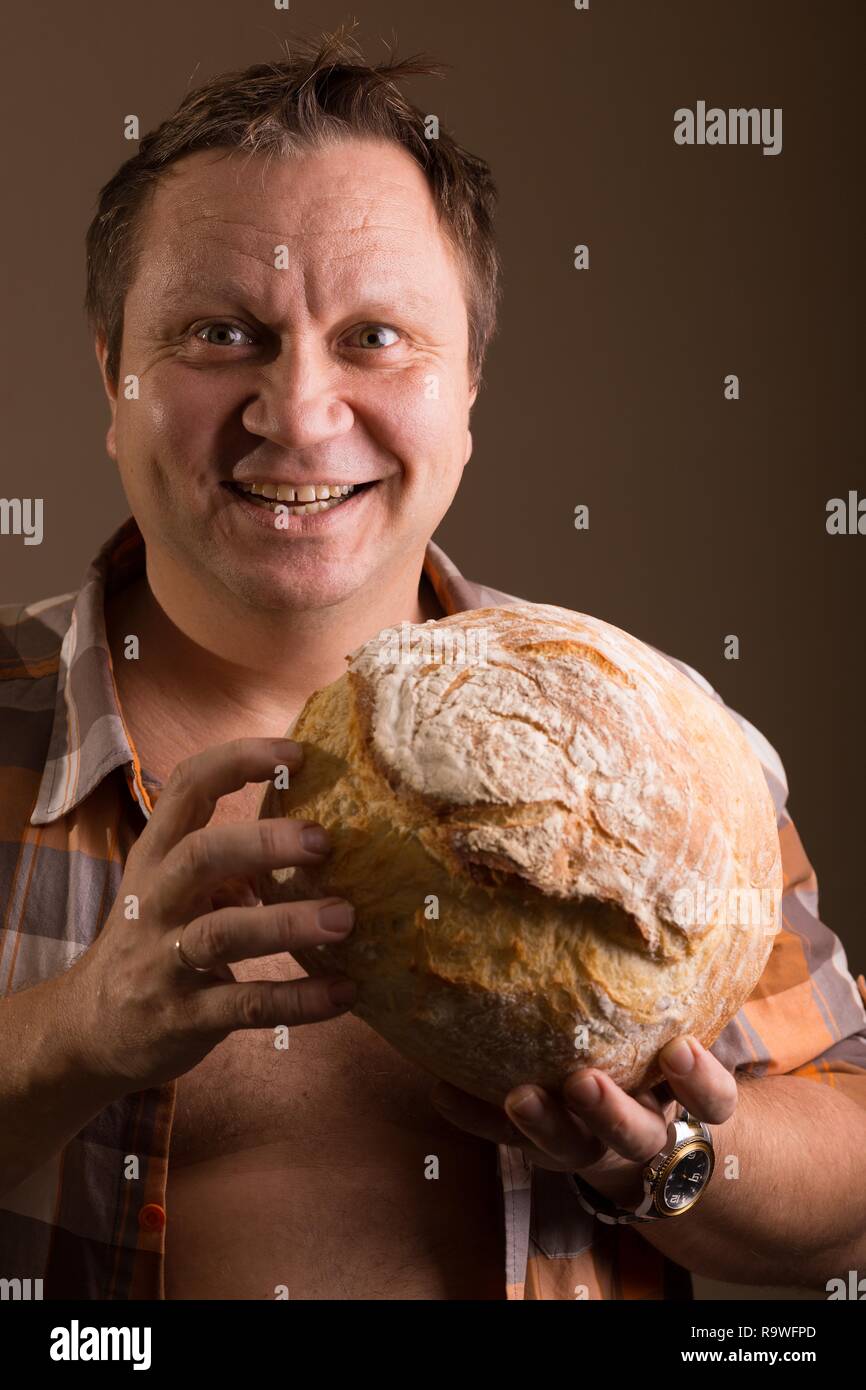 a man and a loaf of bread. human emotions Stock Photo - Alamy