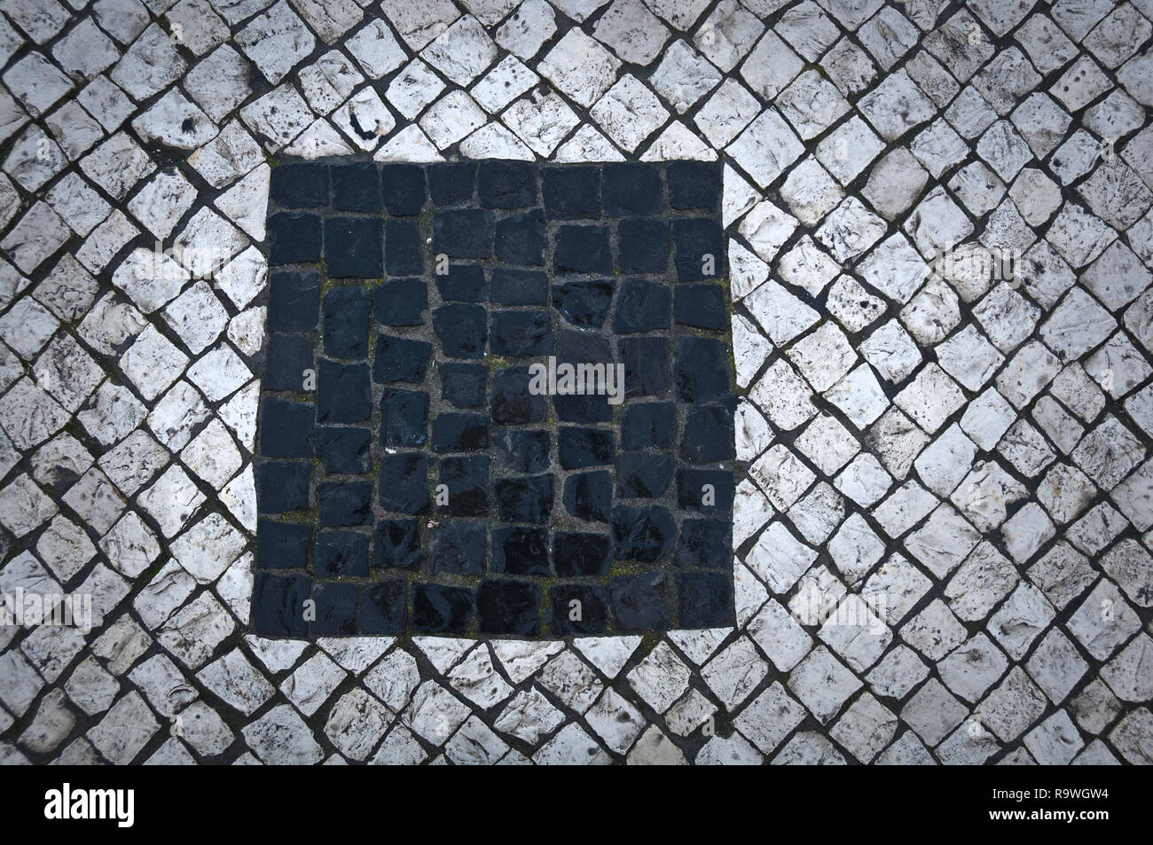 Playing with different shapes and patterns of a cobbled street of ...