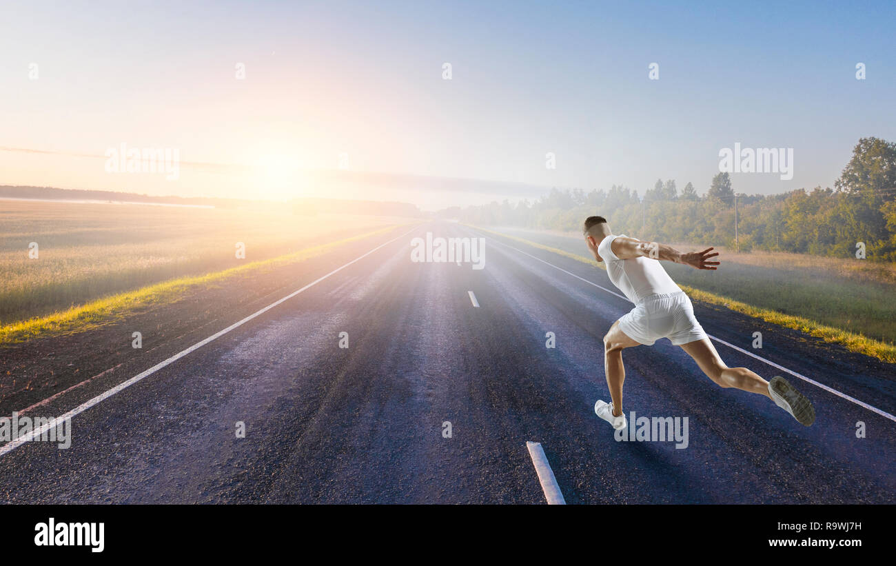 Athlete man running race. Mixed media Stock Photo - Alamy