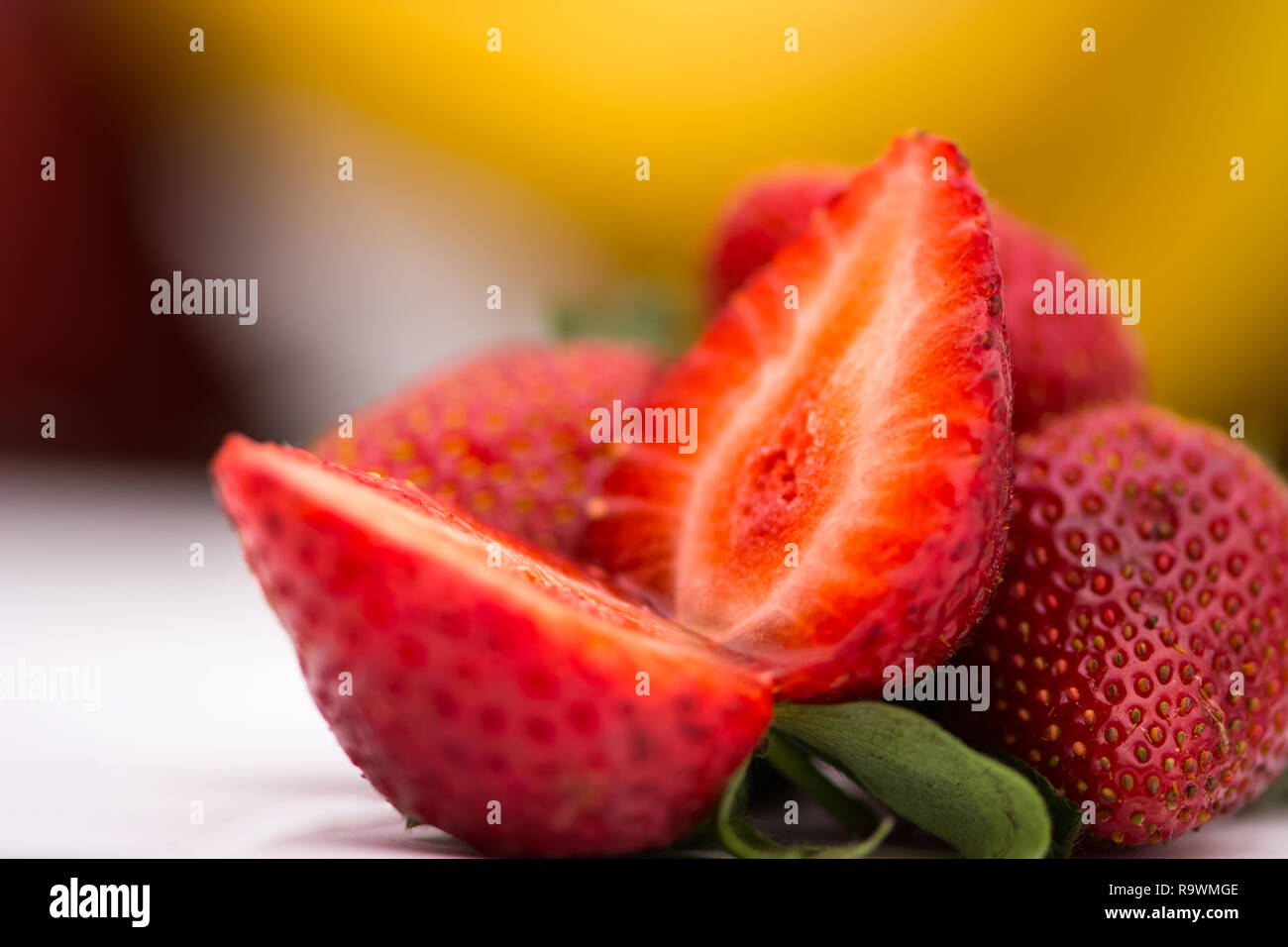 Isolated fresh half cut strawberry Stock Photo - Alamy