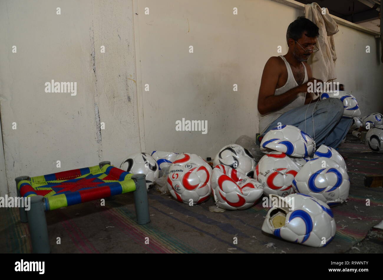 Pakistani leather industry workers workingin football factory Stock ...