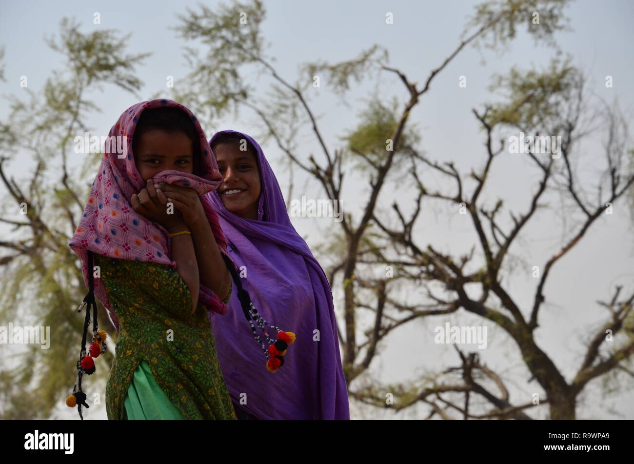 Two girls smile, rural Sindh, Pakistan Stock Photo - Alamy