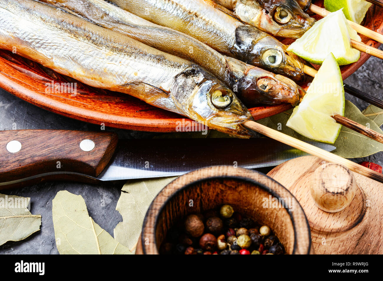 Smoked fish with spices.Cold smoked fish.Smoked capelin Stock Photo - Alamy