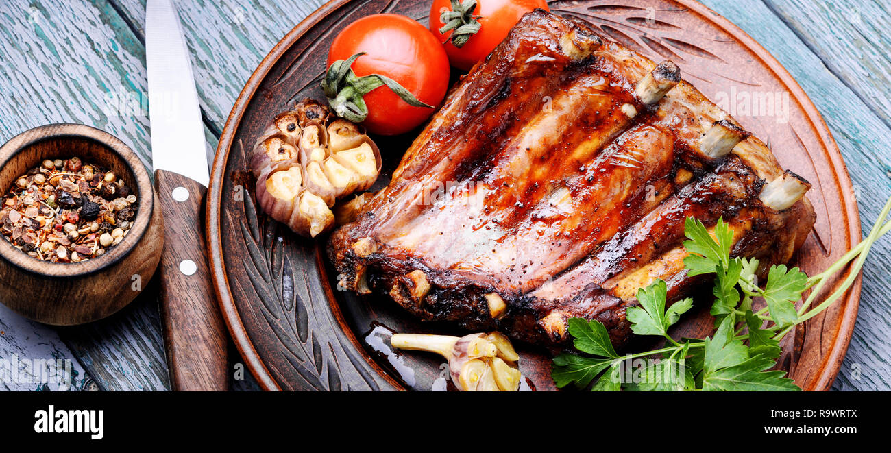 Delicious grilled barbecue pork rib on plate.Spareribs.American cuisine ...