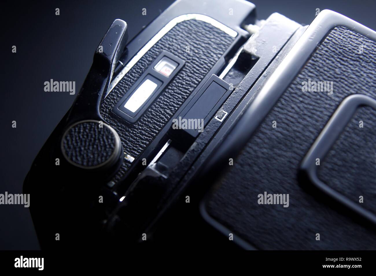 Close up shot of the film cartridge and film advance crank or lever of ...