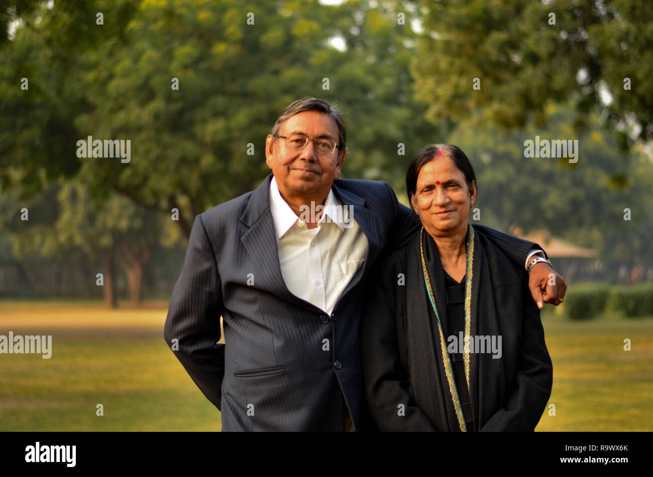 Happy looking retired senior Indian man and woman couple smiling and ...
