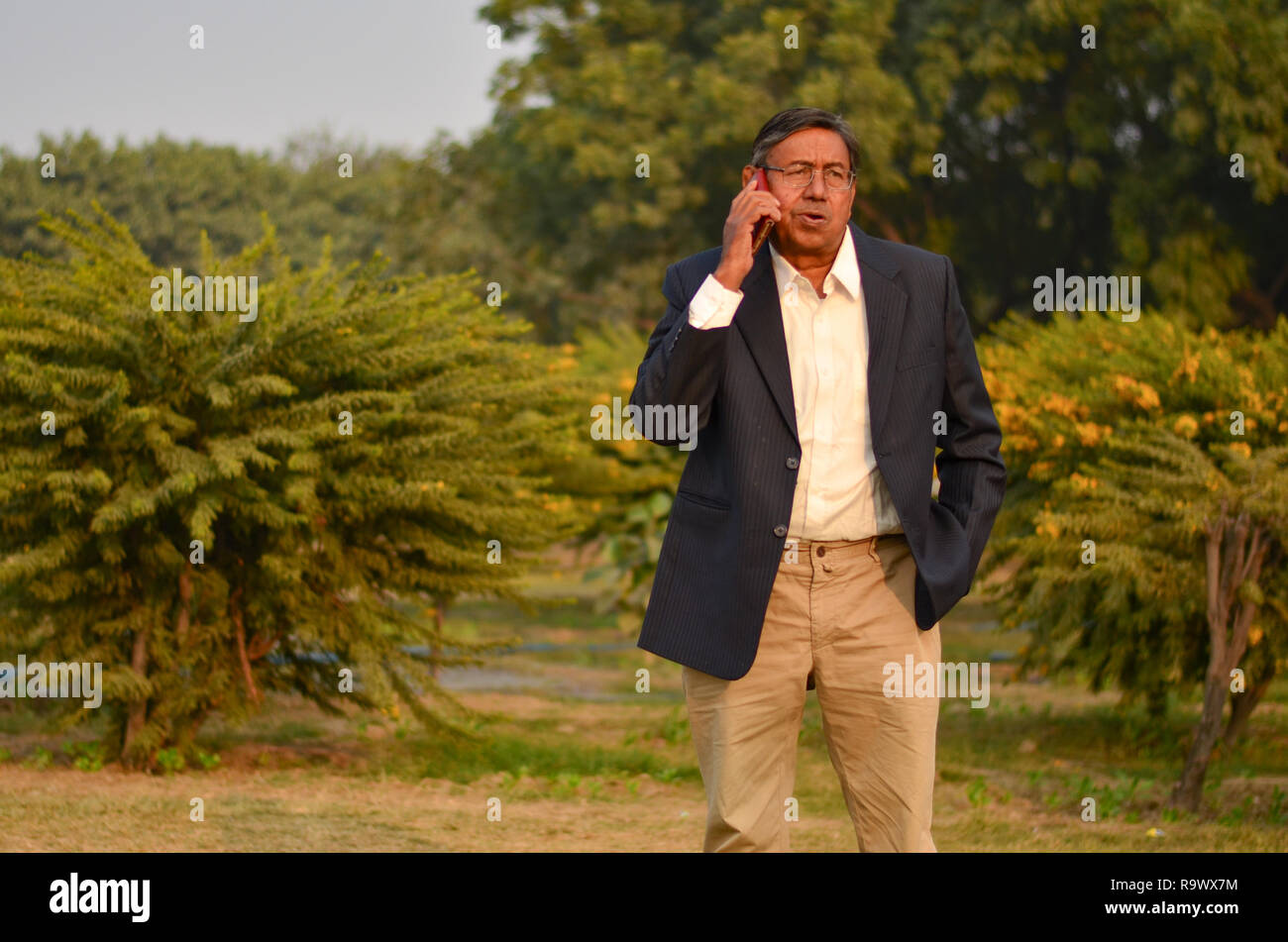 Elderly indian man talking hi-res stock photography and images - Alamy