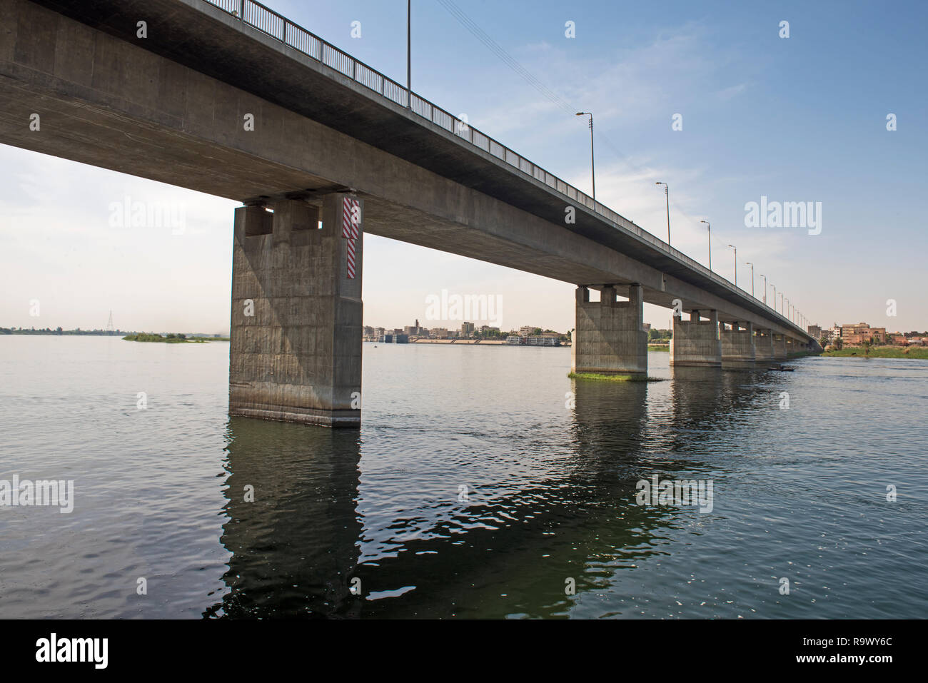 Large concrete road bridge spanning large wide nile river in Egypt at ...
