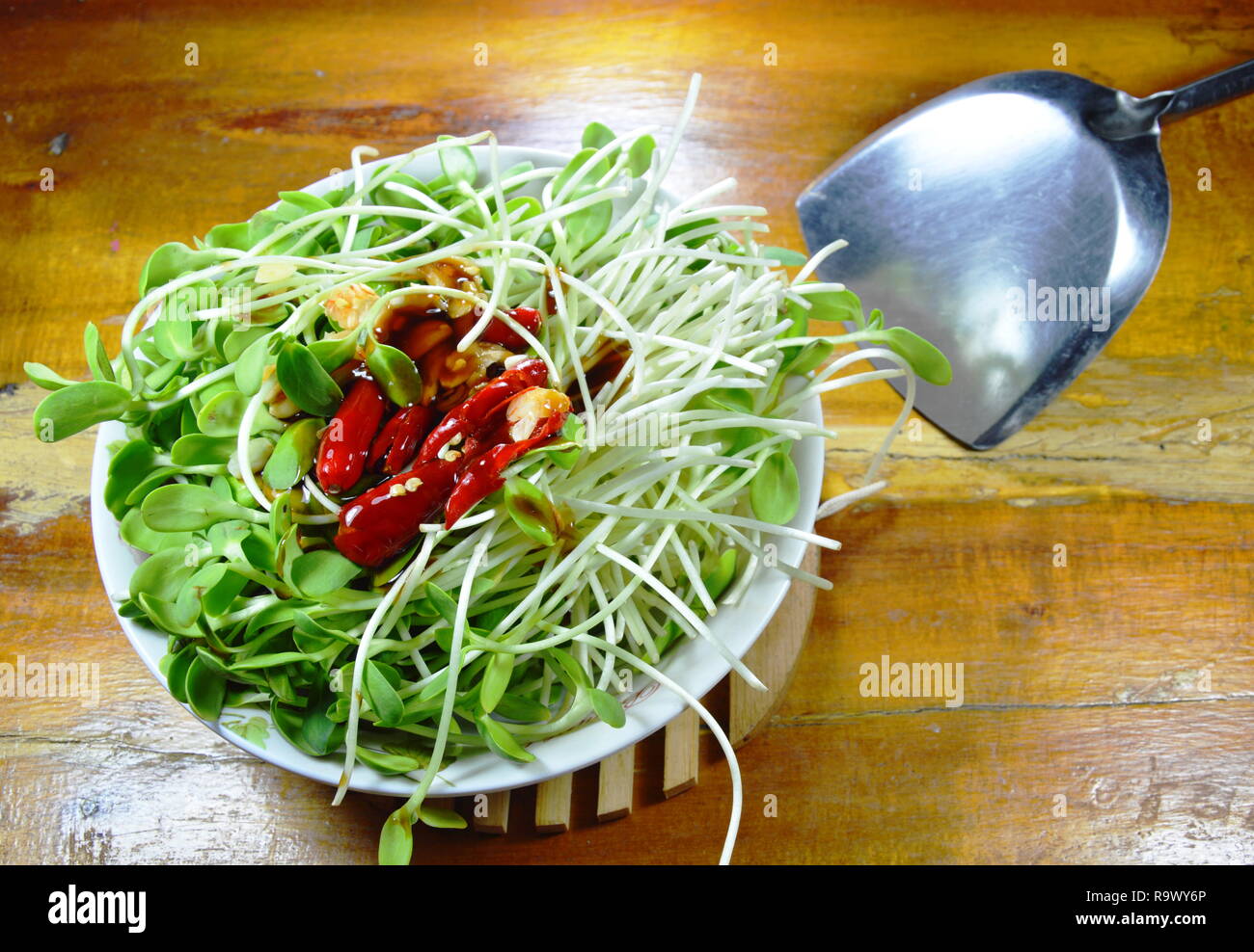 raw sunflower sprout and iron flipper prepare to cook Stock Photo - Alamy