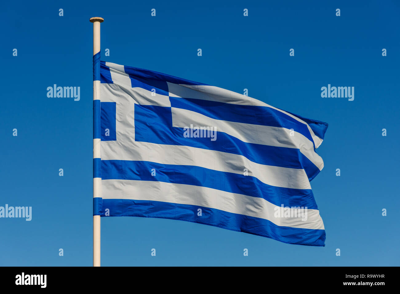 Flag greece waving on flagpole hi-res stock photography and images - Alamy