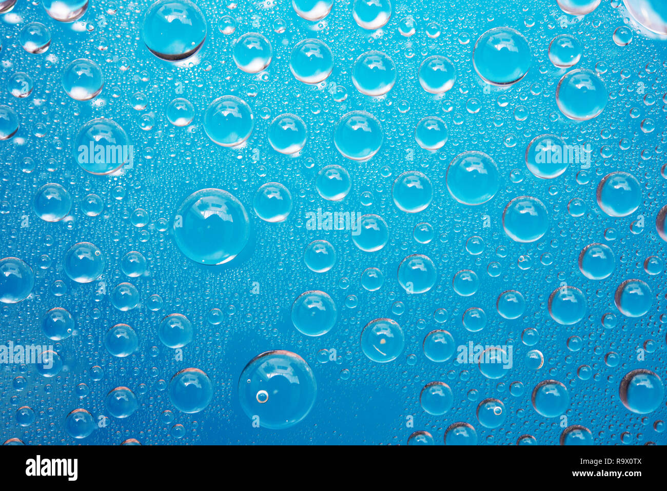 Abstract blue water drops background Stock Photo - Alamy