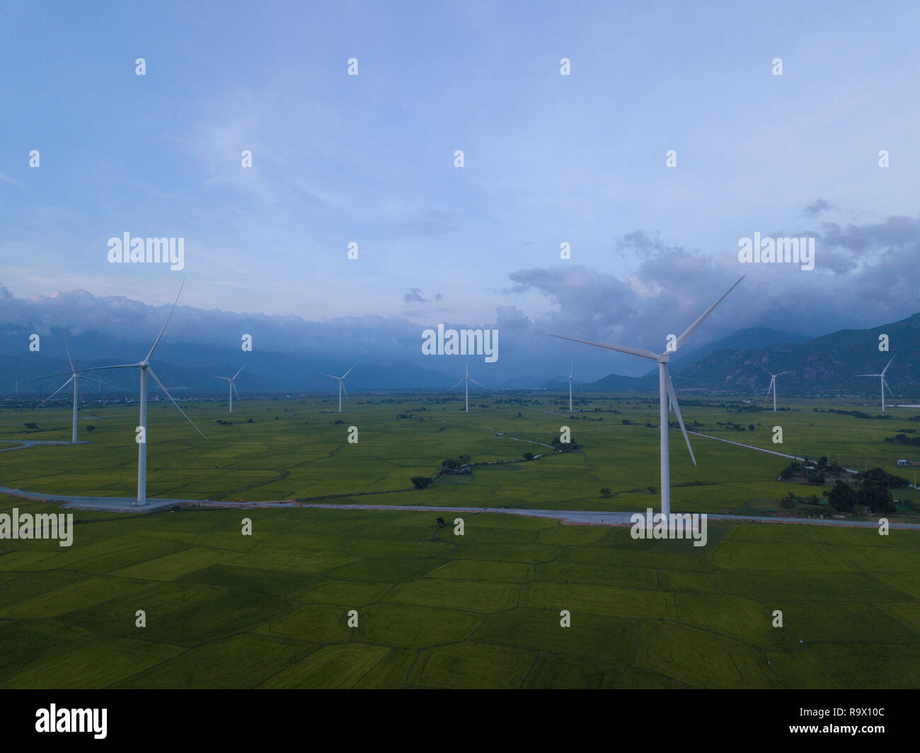 Wind turbine farm or windmill on blue sky. Turbine green energy ...