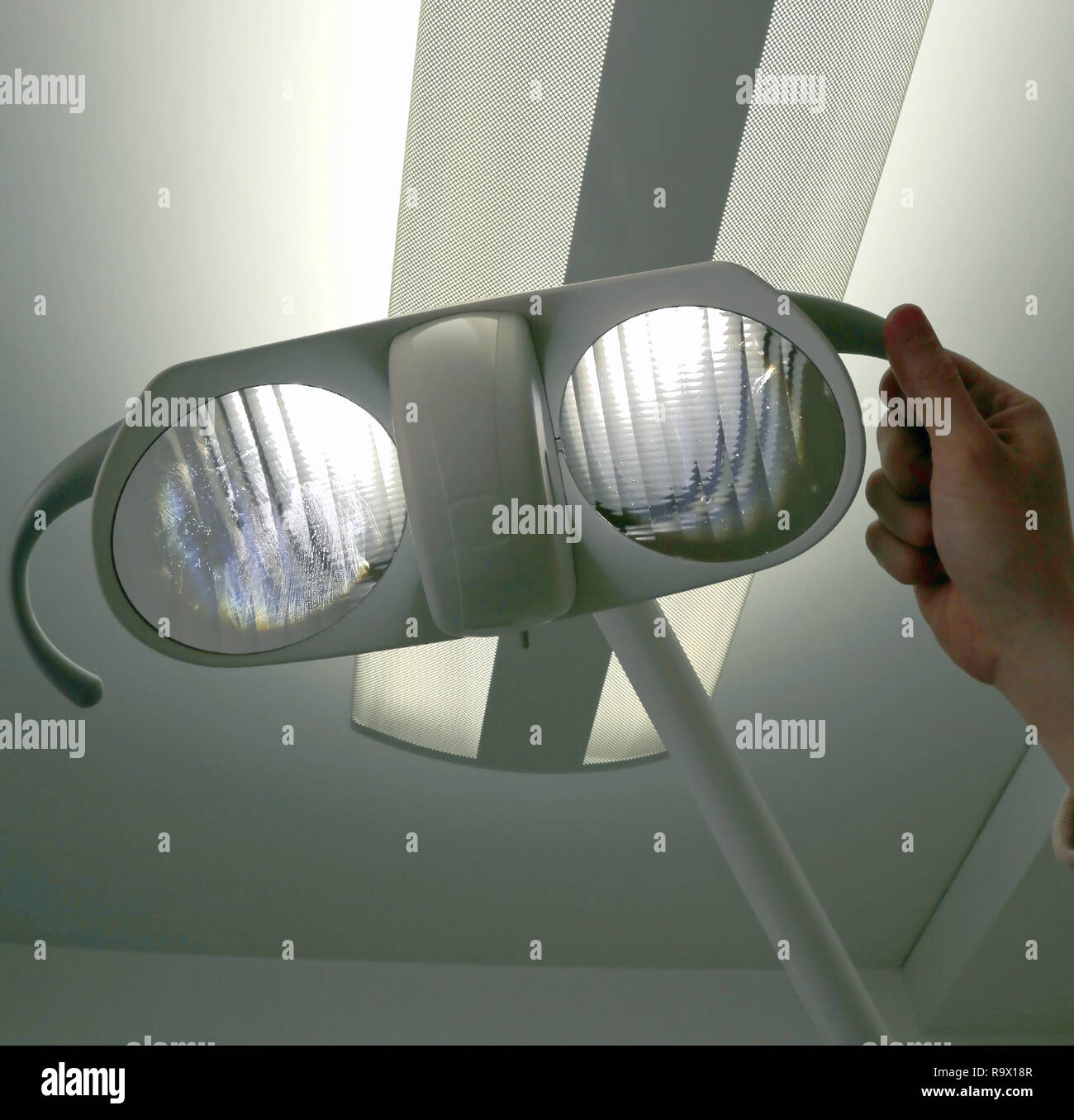 surgical lighting in the operating theater of hospital nad the hand of ...