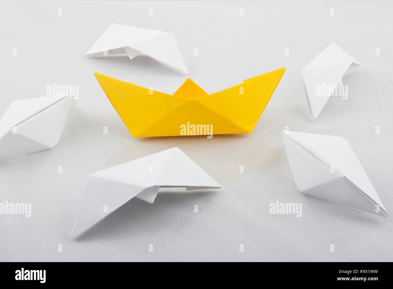 Sinking ships, origami concept Stock Photo - Alamy