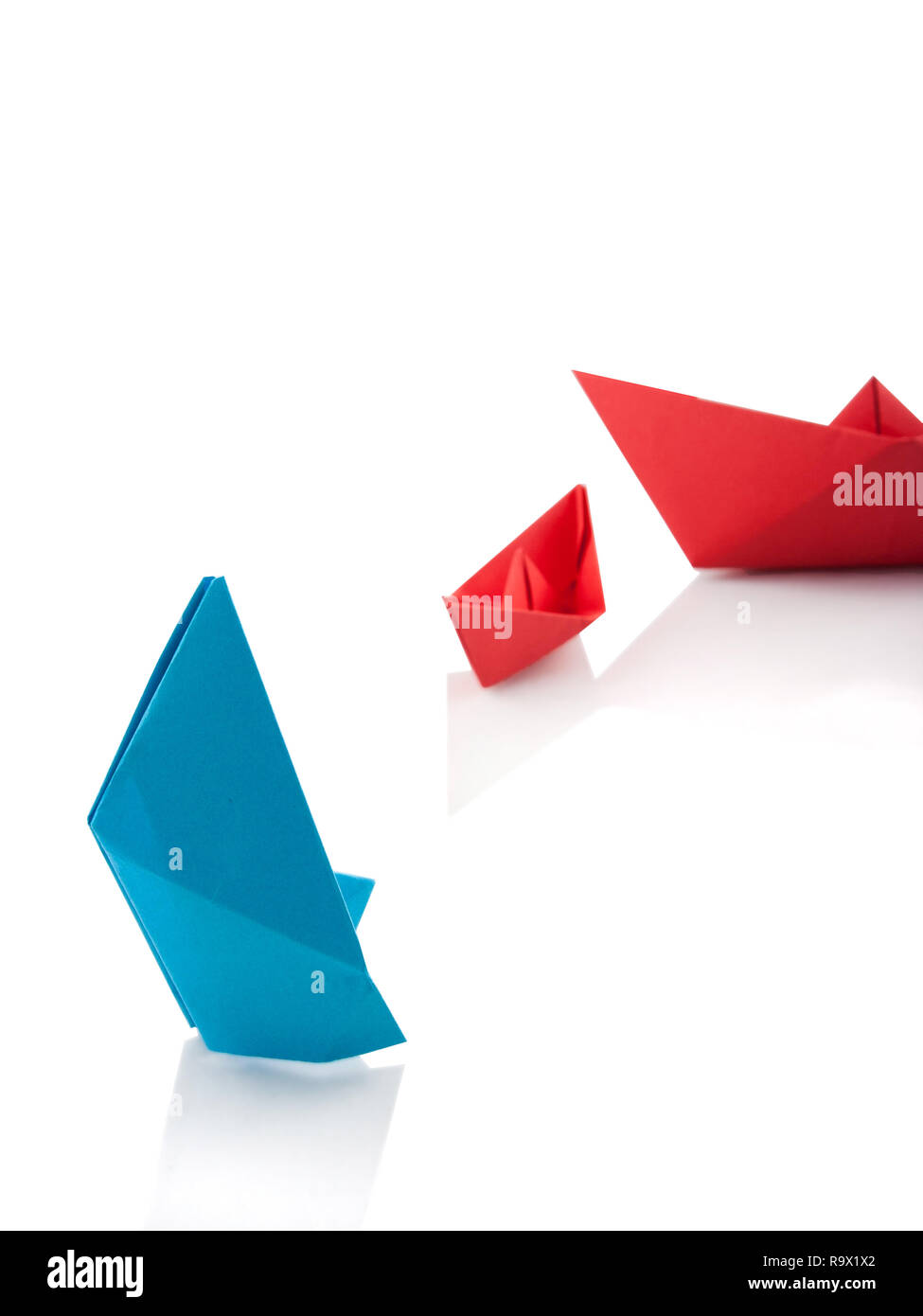 Sinking ships, origami concept Stock Photo - Alamy