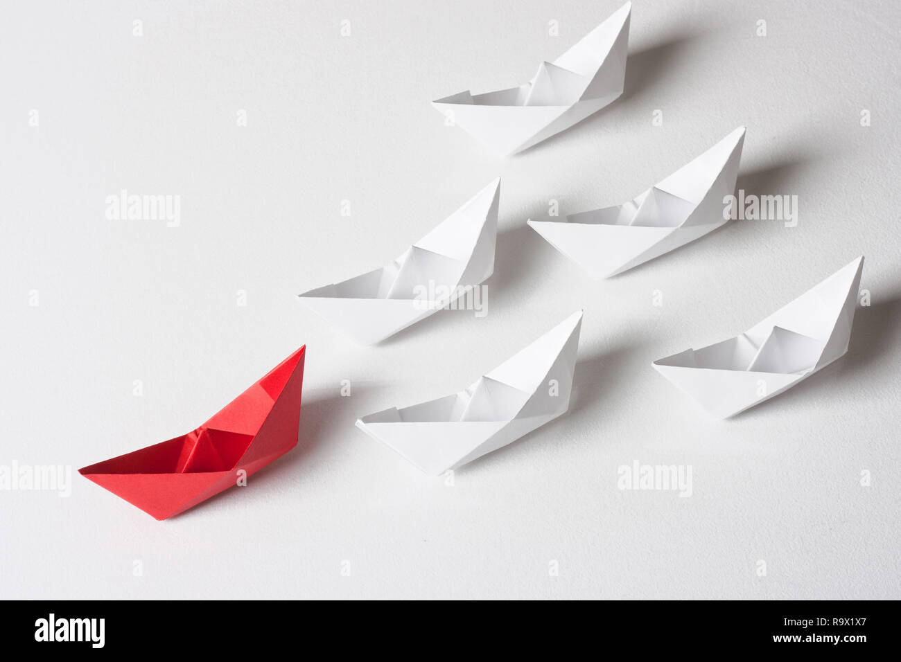 Red origami leader ship, leadership concept Stock Photo - Alamy