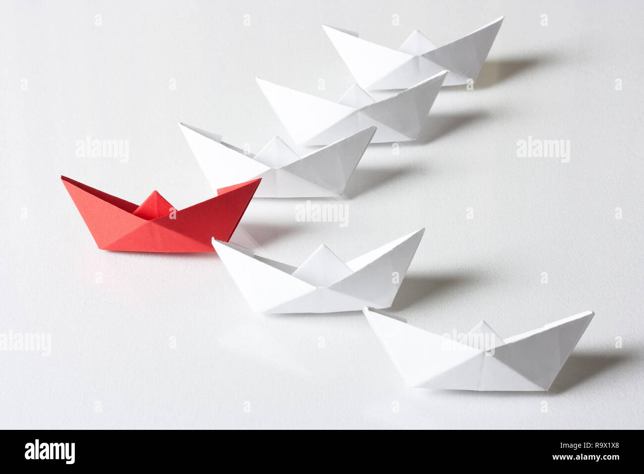 Red origami leader ship, leadership concept Stock Photo - Alamy
