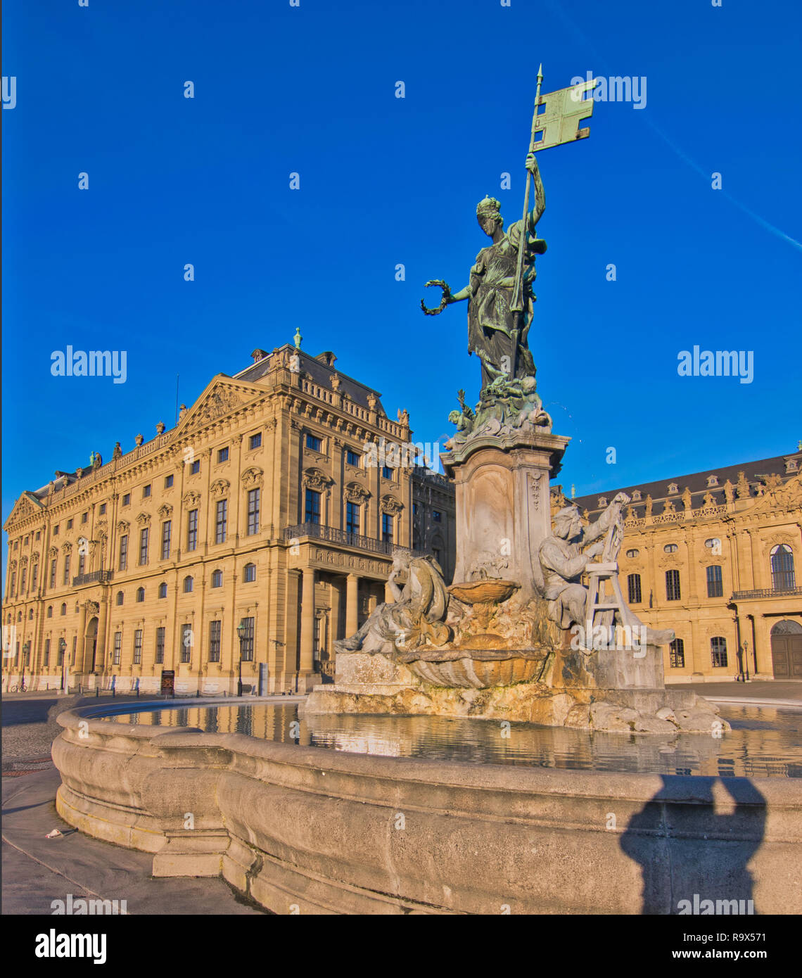 The fountain statue in front of the prince bishop residence of Wurzburg ...