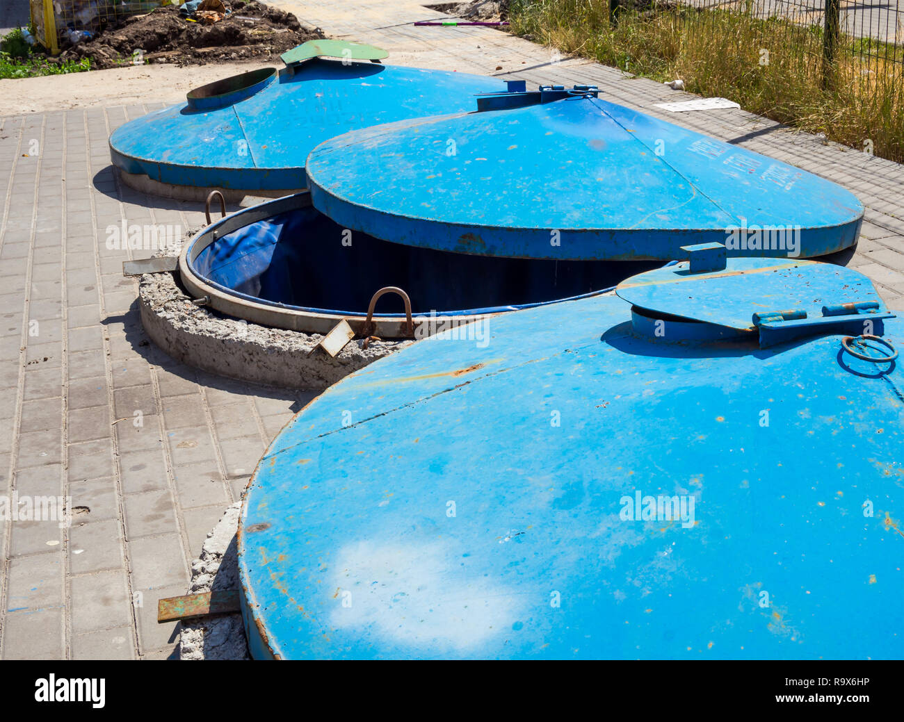 Line of buried waste containers on the site for household waste Stock ...