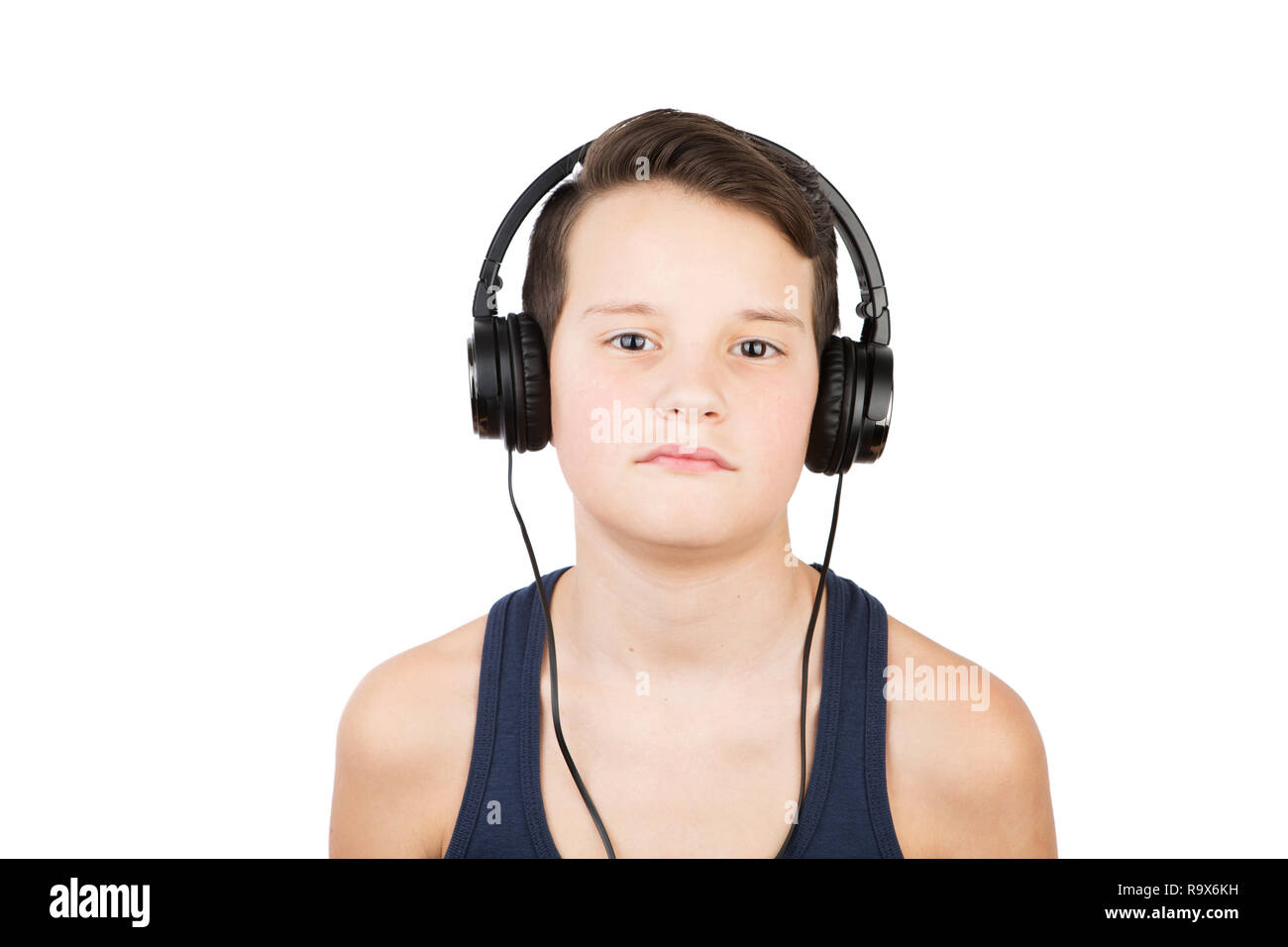 Music concept - Young beautiful teenager boy with headphones on head ...
