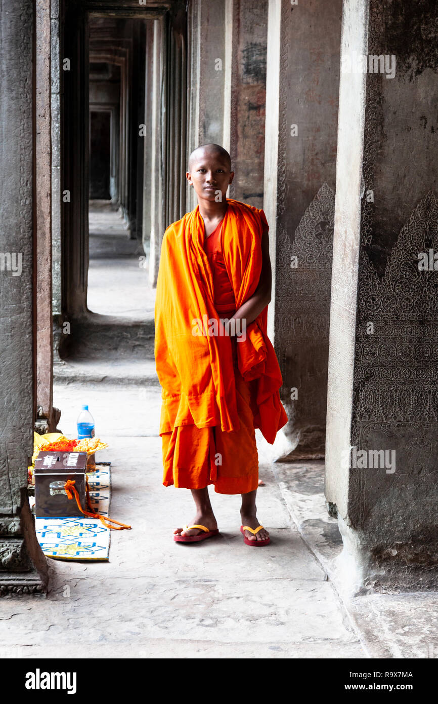 Buddhist monk posing for picture inside temple Stock Photo - Alamy