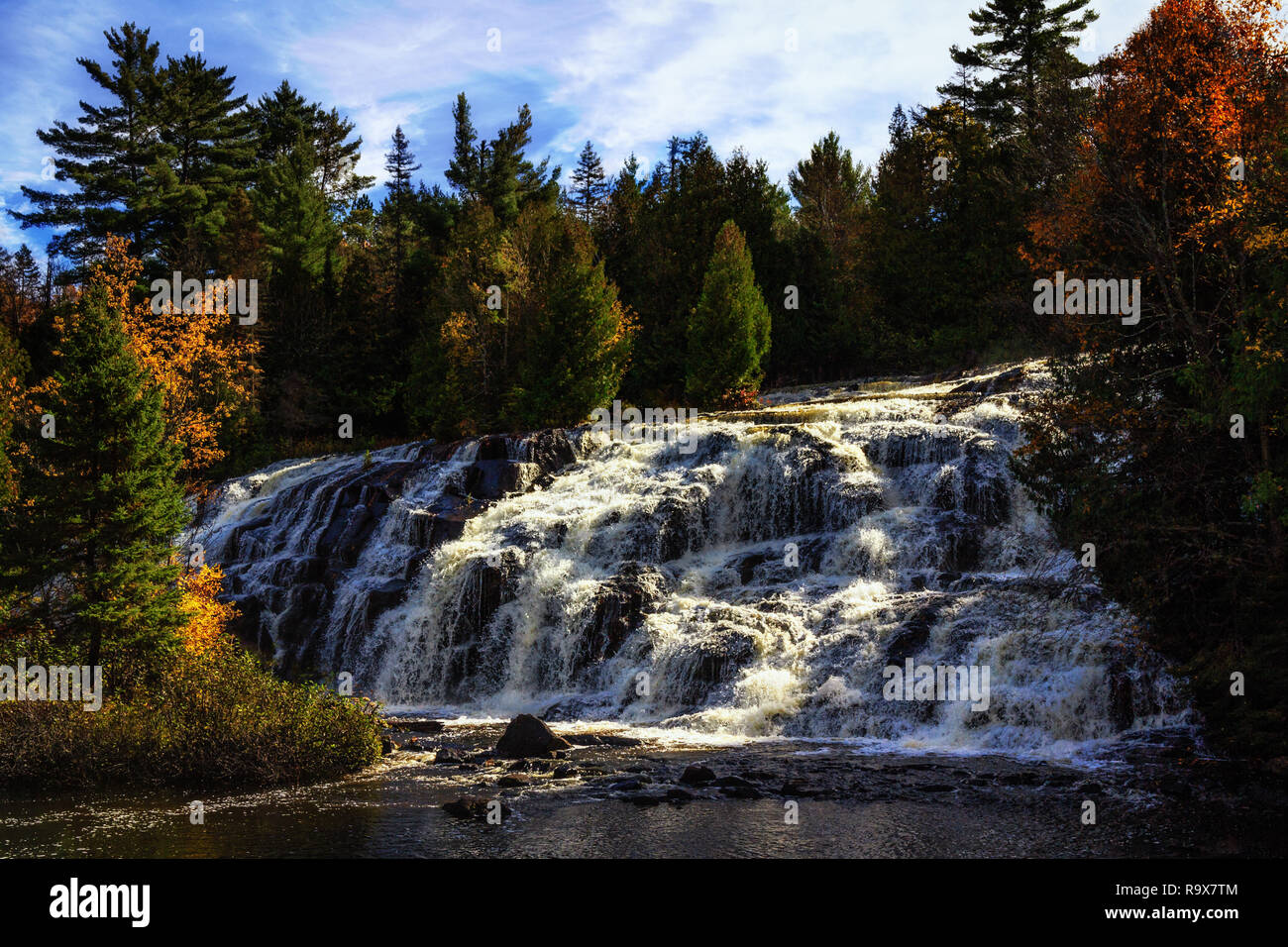 Bond Falls waterfall in Michigan's Upper Peninsula. Spectacular autumn ...
