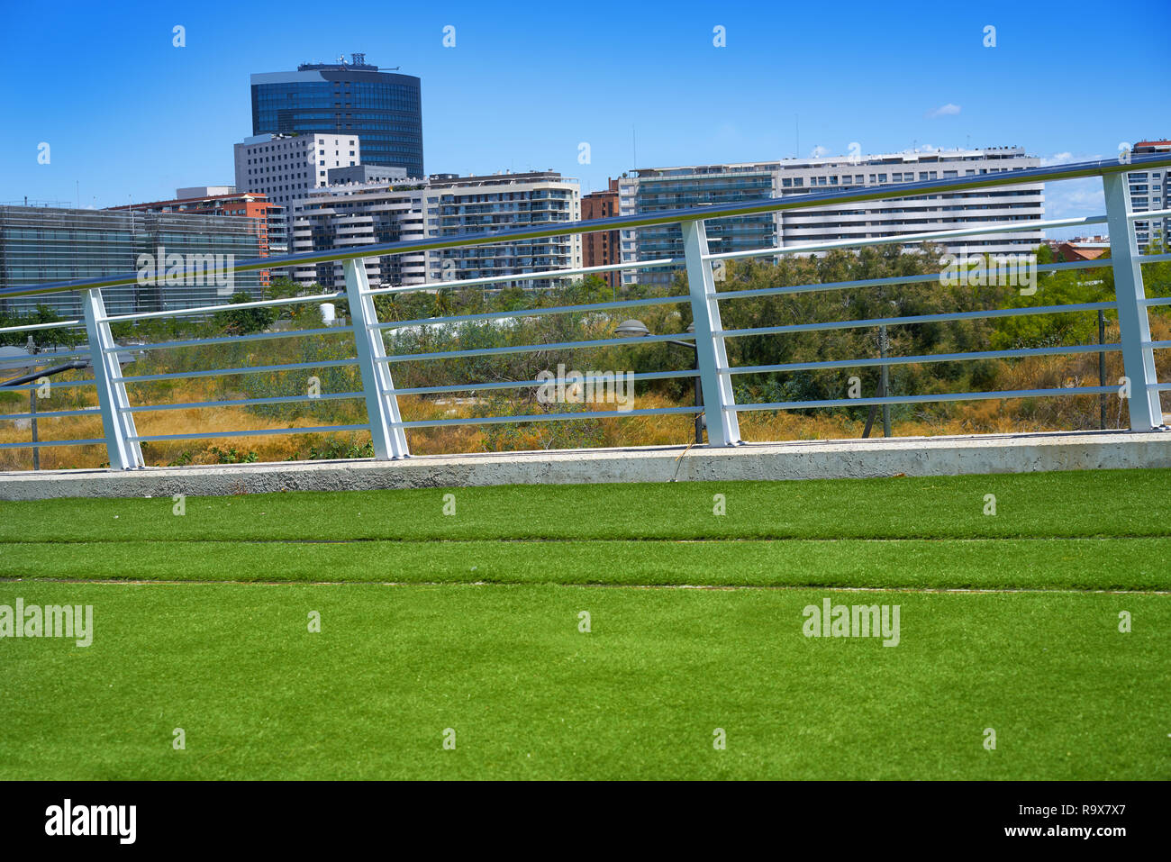 Valencia train railway with green turf grass and railing at spain Stock ...