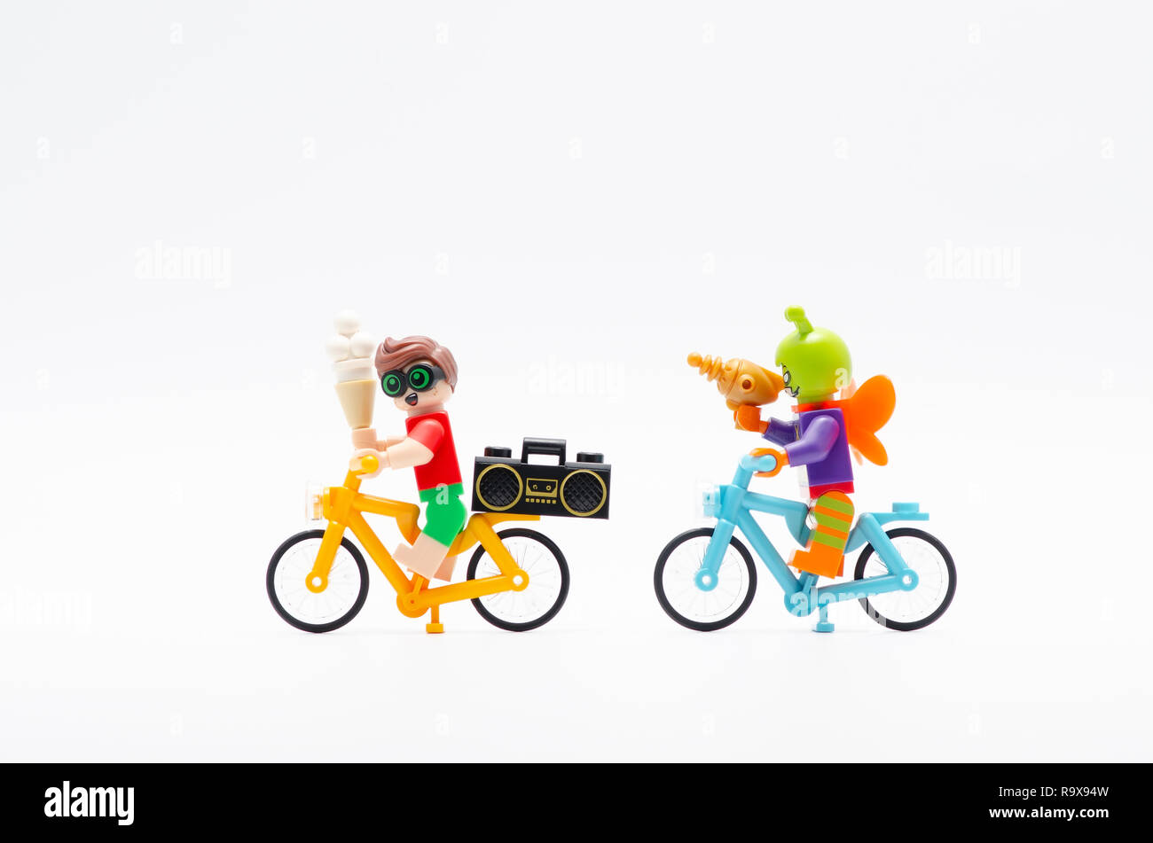 lego killer moth chasing robin riding bicycle with radio at his back ...