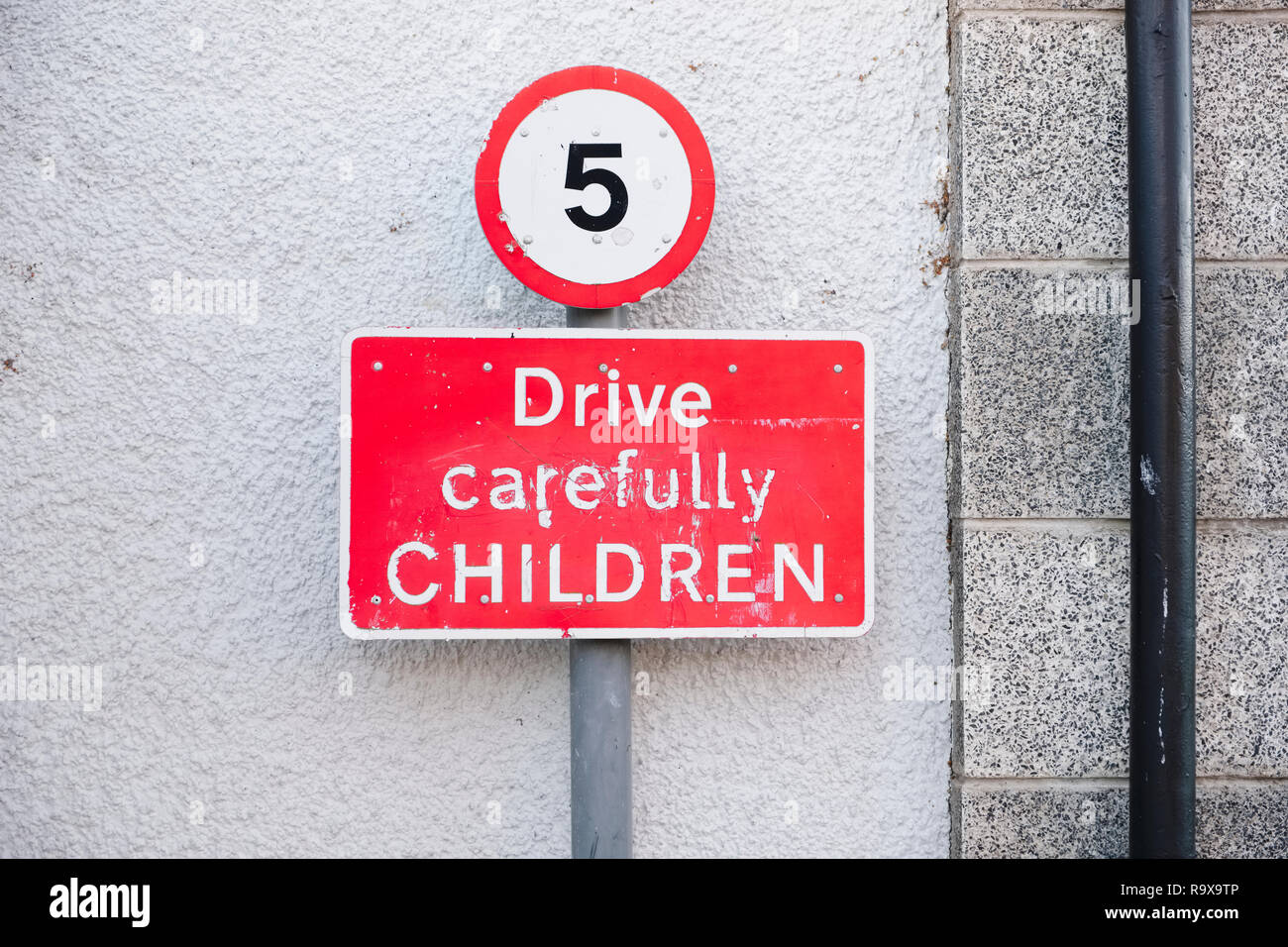 5 mph road sign post at school for safety of children Stock Photo - Alamy