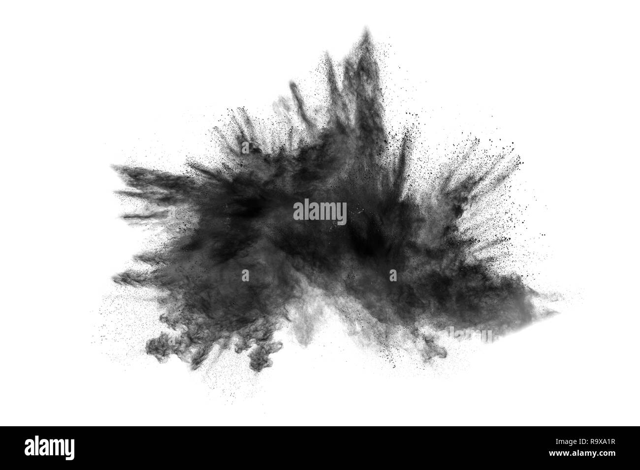 Black particles splattered on white background. Black powder dust ...