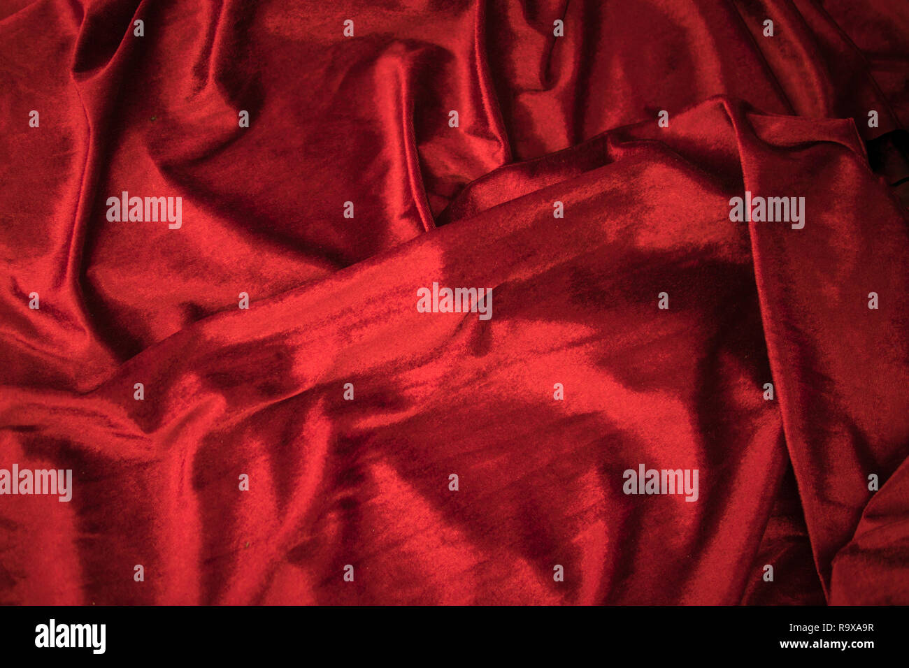 Fold soft waved red velour fabric textured background Stock Photo - Alamy