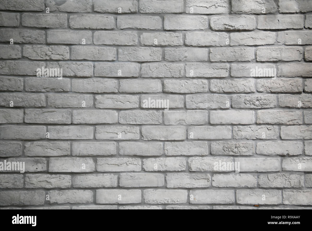 Modern white grey brick wall textured background Stock Photo - Alamy