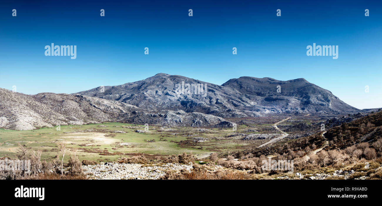 View of green field amidst mountain peak Crete Greece Europe Stock ...