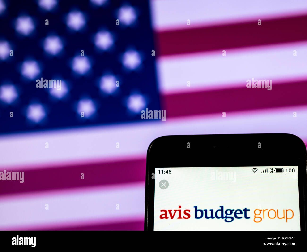 Avis Budget Group Car rental company logo seen displayed on smart phone ...