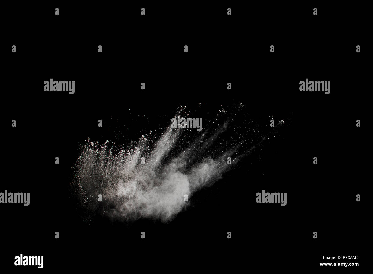 Bizarre forms of white powder explosion on white background.Launched ...