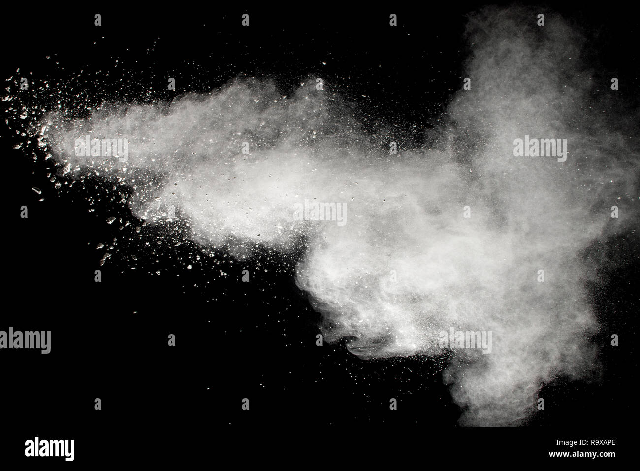 Bizarre forms of white powder explosion on white background.Launched ...
