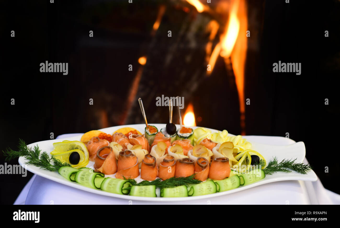 Assorted fish platter with lemon and cucumber. Serving fish platter of ...