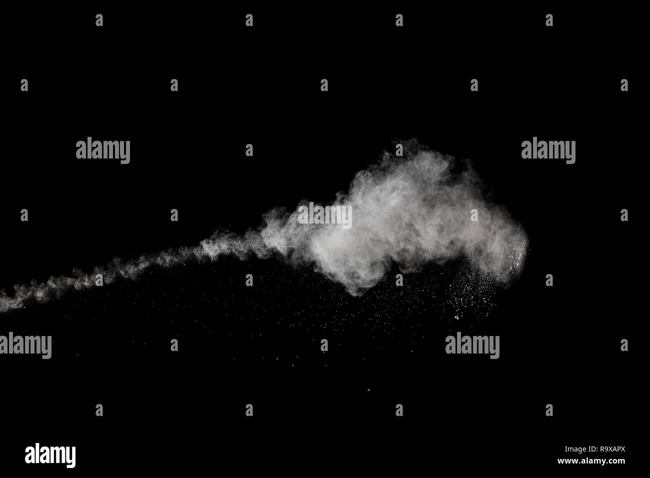 Bizarre forms of white powder explosion on white background.Launched ...