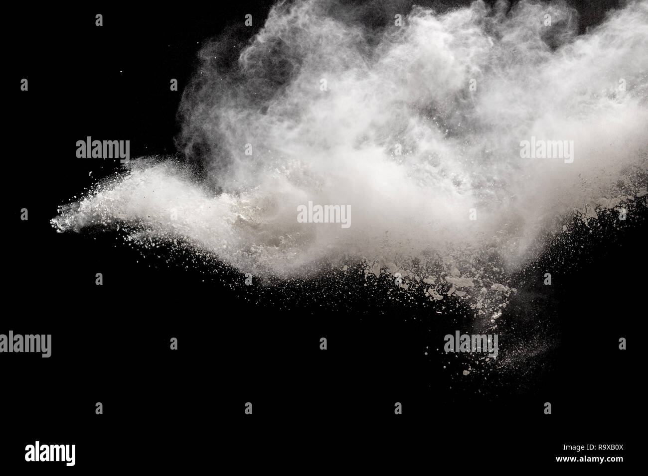 Bizarre forms of white powder explosion on white background.Launched ...