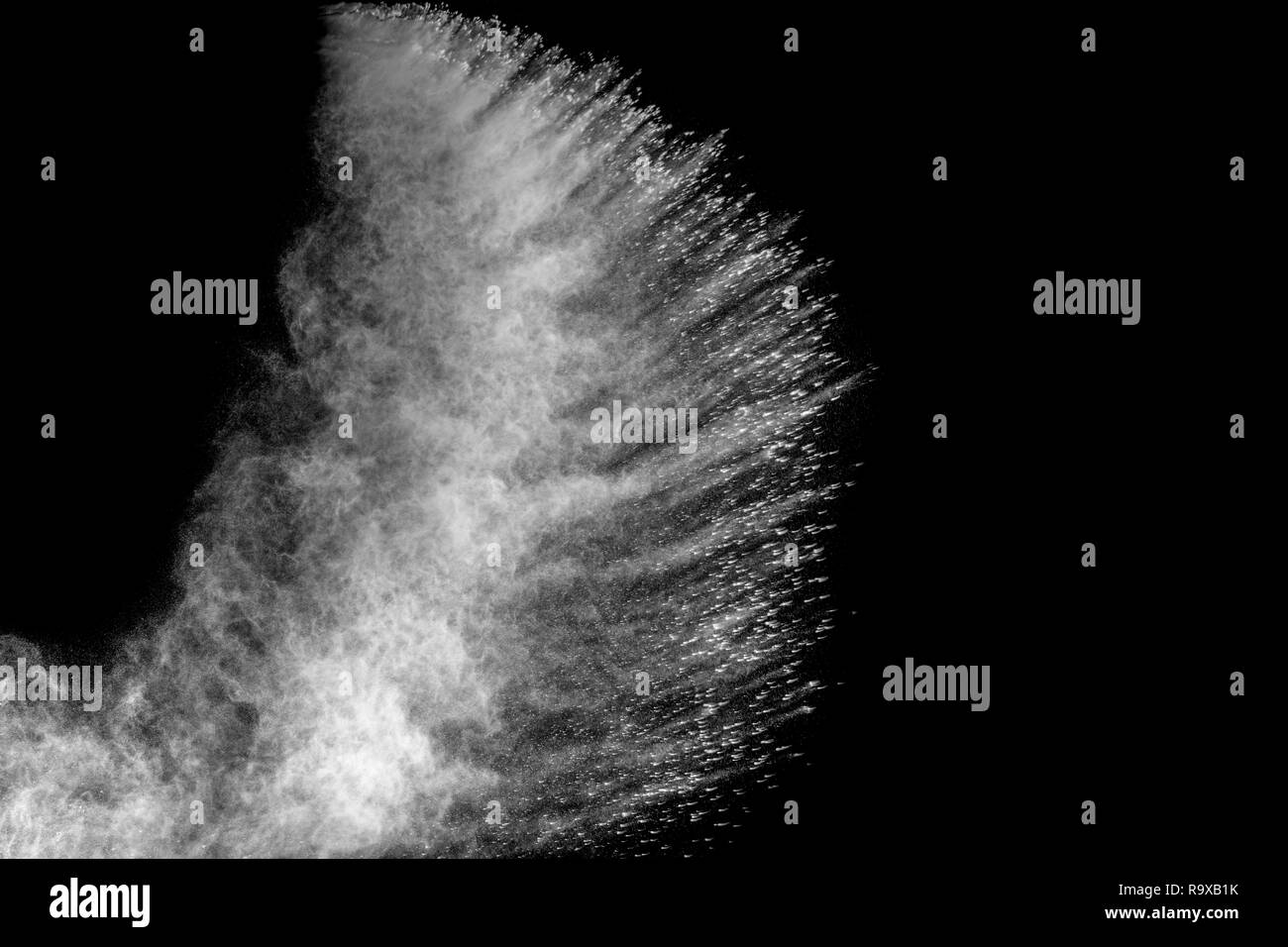 Bizarre forms of white powder explosion on white background.Launched ...