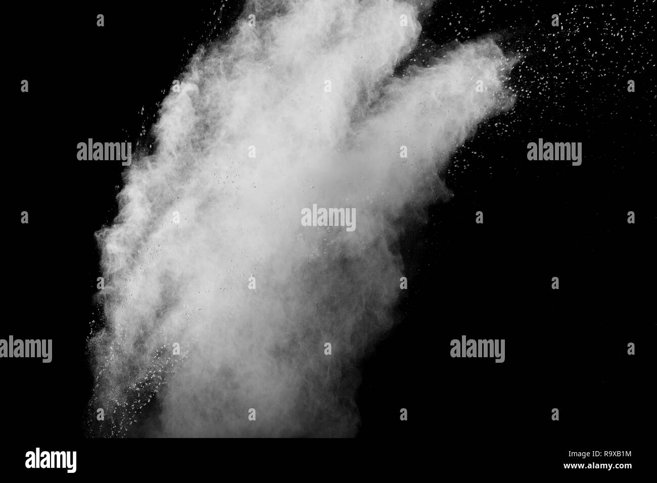 Bizarre forms of white powder explosion on white background.Launched ...