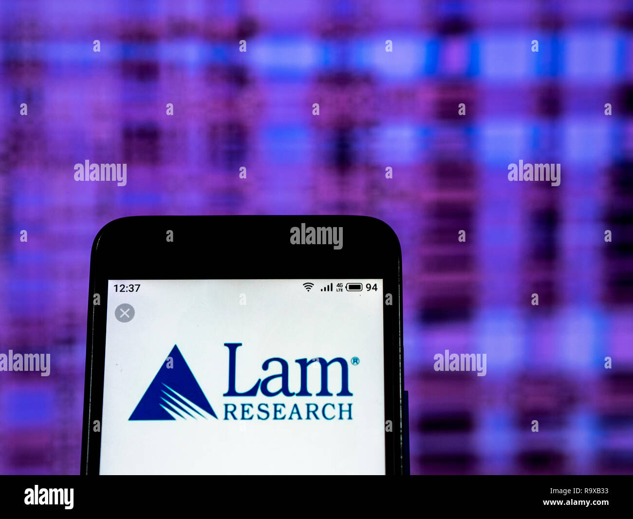 Lam Research Corporation logo seen displayed on smart phone Stock Photo ...