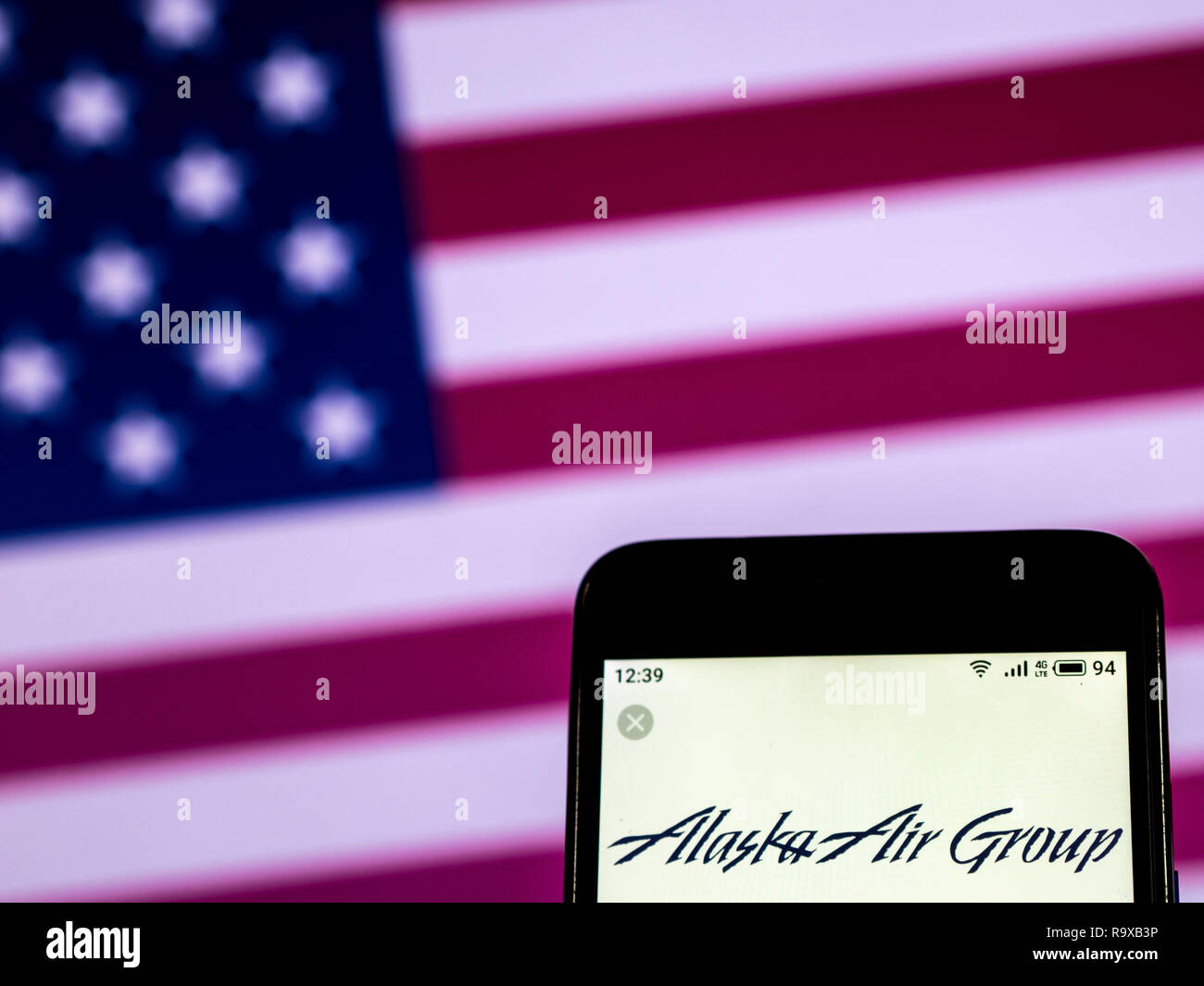 Alaska Airlines logo seen displayed on smart phone Stock Photo - Alamy