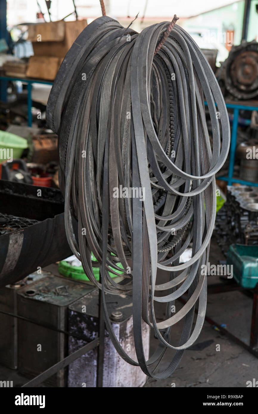 Old belt change from the car in the car repair shop Stock Photo - Alamy