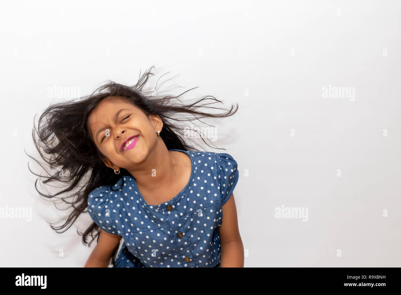 Little girl playing with her hair Stock Photo - Alamy