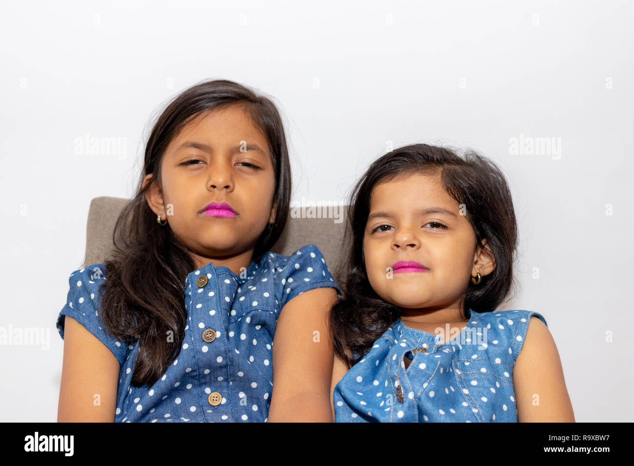 Beautiful smiling sisters with dresses Stock Photo - Alamy
